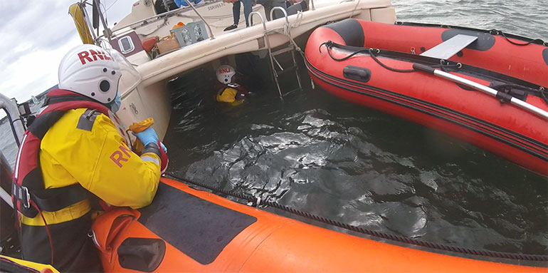 Catamaran cut free in Poole Harbour by Poole lifeboats