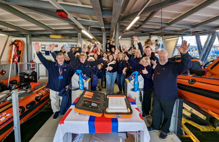 Poole lifeboat stalwart signs RNLI 200th anniversary scroll
